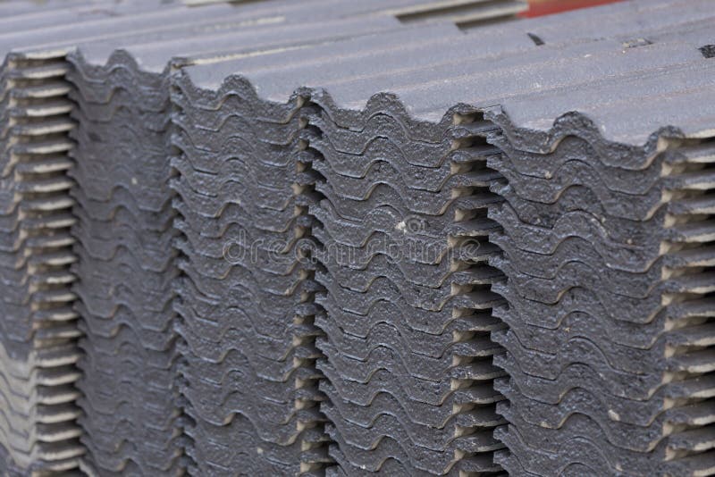 Stack of Black Roof Tiles in Construction Stock Photo - Image of ...