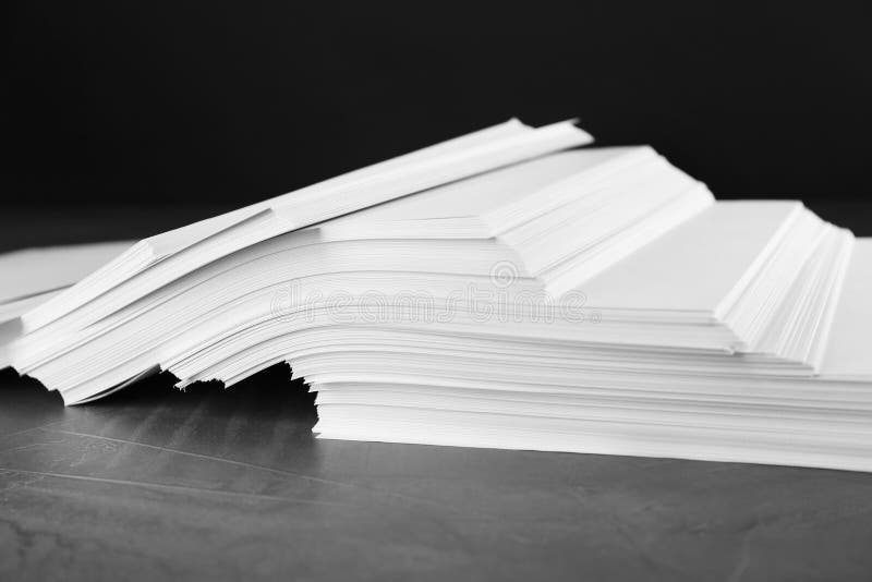 Stack of Blank Paper on Grey Stone Table Against Background Stock Image ...