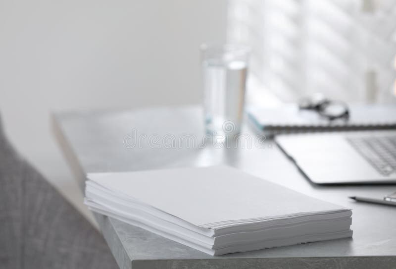 Stack of Blank Paper Sheets on Grey Table in Office, Closeup Stock ...