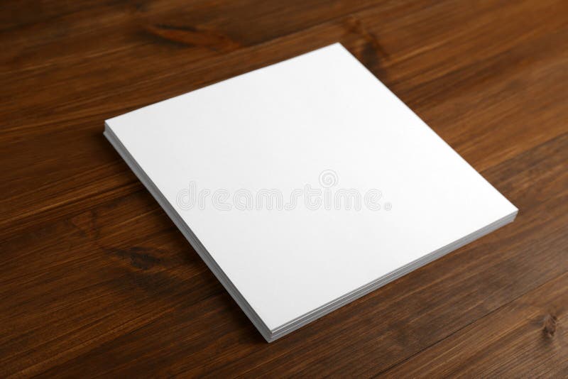 Stack of Blank Paper Sheets on Wooden Table. Brochure Design Stock ...