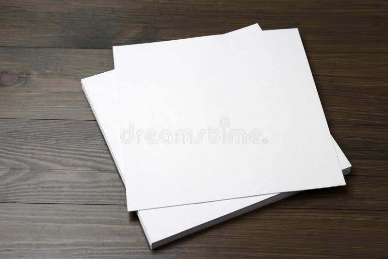 Stack of Blank Paper Sheets on Wooden Table. Brochure Design Stock ...