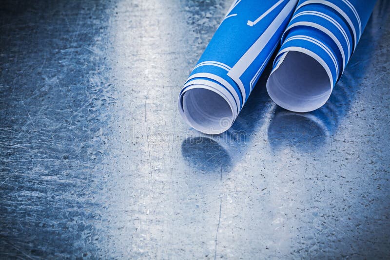 Stack of Blue Construction Plans on Metallic Background Building Stock ...
