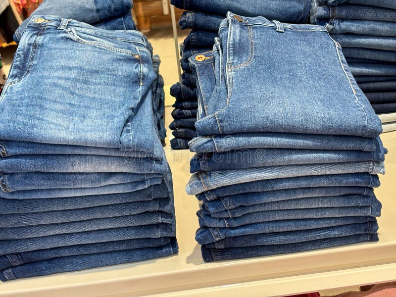 Stack of Blue Denim Jeans in a Shopping Mall Stock Image - Image of ...
