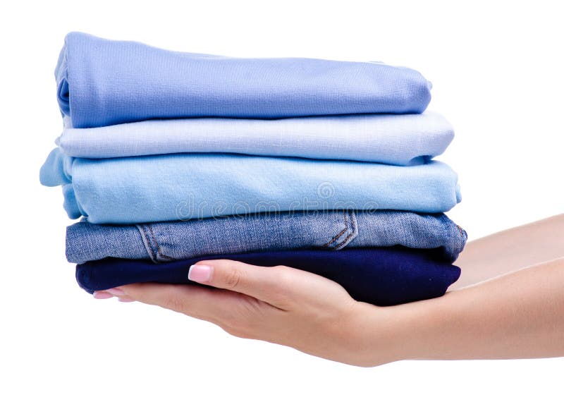 Stack Blue Folded Clothing in Hand Stock Image - Image of garment ...
