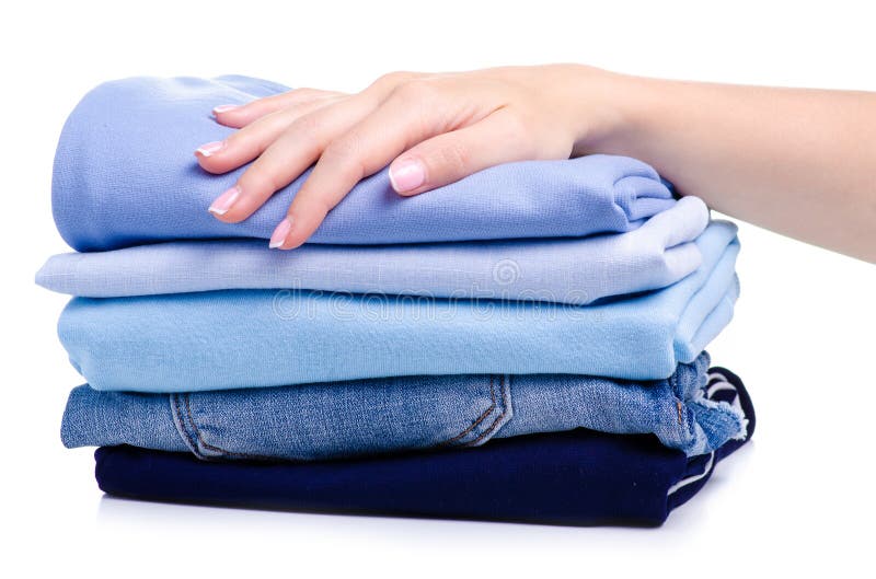 Stack Blue Folded Clothing in Hand Stock Photo - Image of heap, folded ...