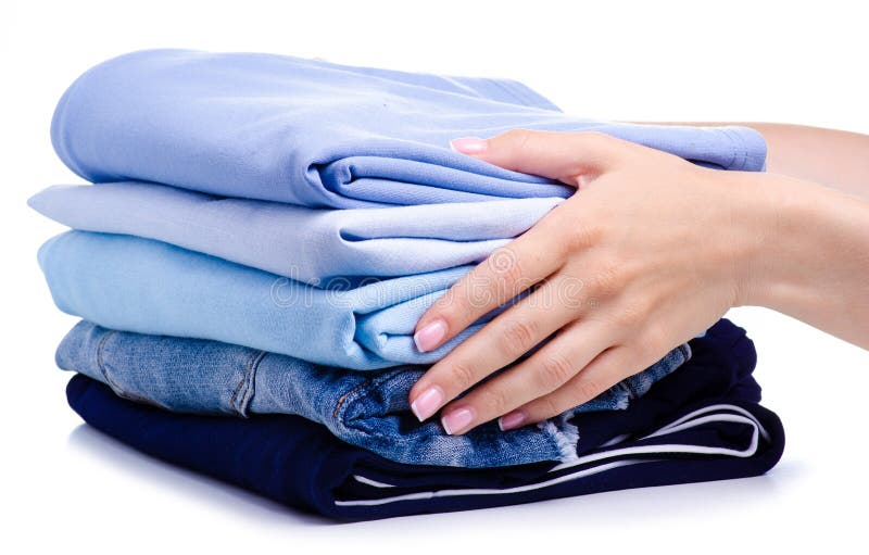 Stack Blue Folded Clothing in Hand Stock Photo - Image of denim ...