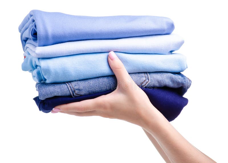 Stack Blue Folded Clothing in Hand Stock Photo - Image of color, casual ...