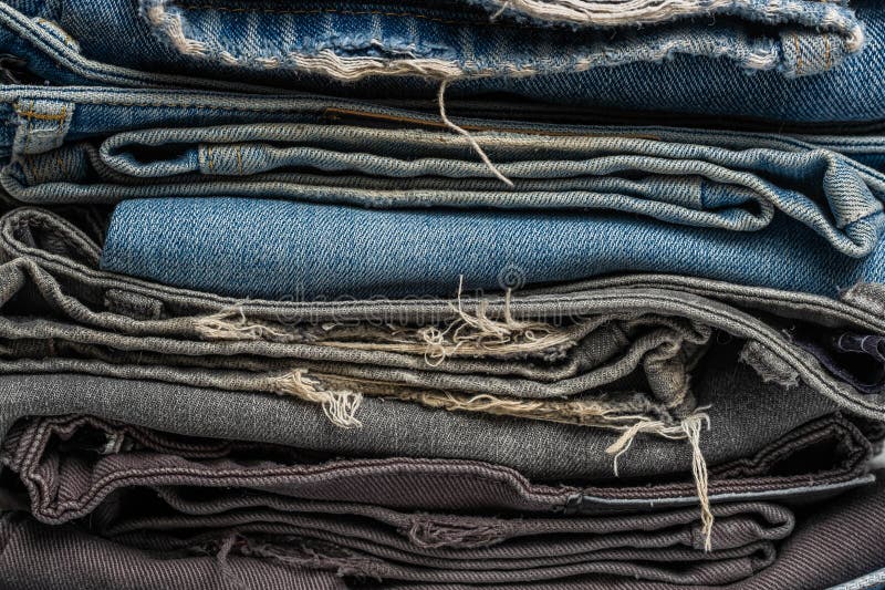 Stack of Blue and Gray Ripped Jeans. Denim Background Stock Image ...