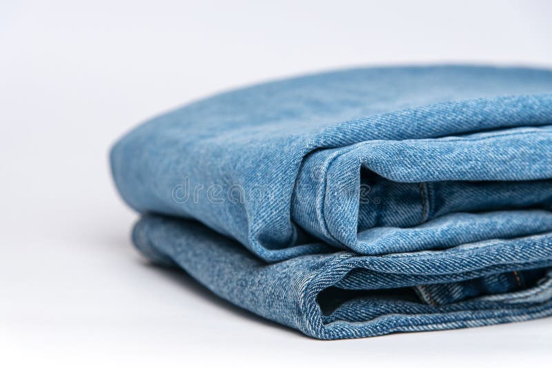 Stack of Blue Jeans on White Background Stock Image - Image of denim ...