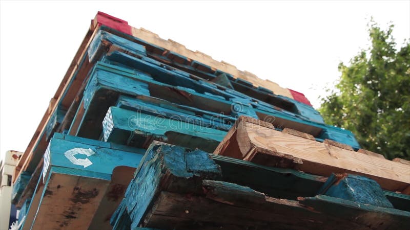 Stack of Blue Palettes Skids on Top of One Another with Wood Colored ...