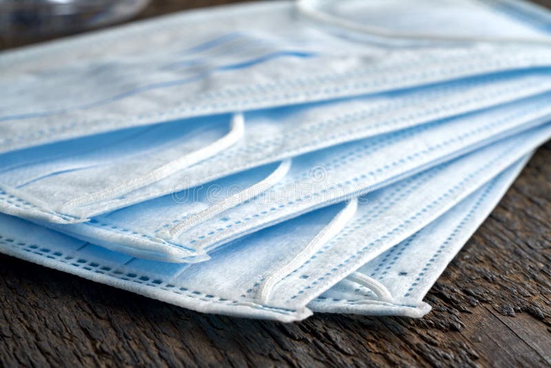 A Stack of Blue Surgical Earloop Face Mask Destined To Prevent the ...