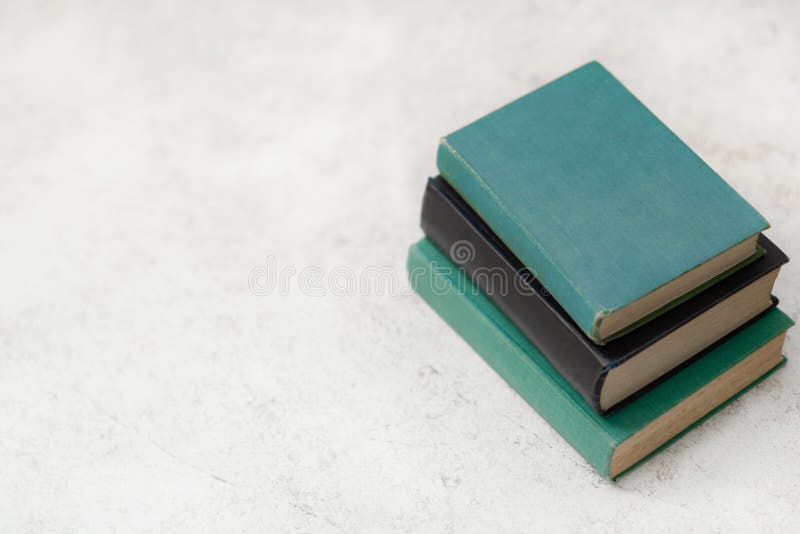 Stack of Blue Vintage Books on White Marble Background with Copy Space ...