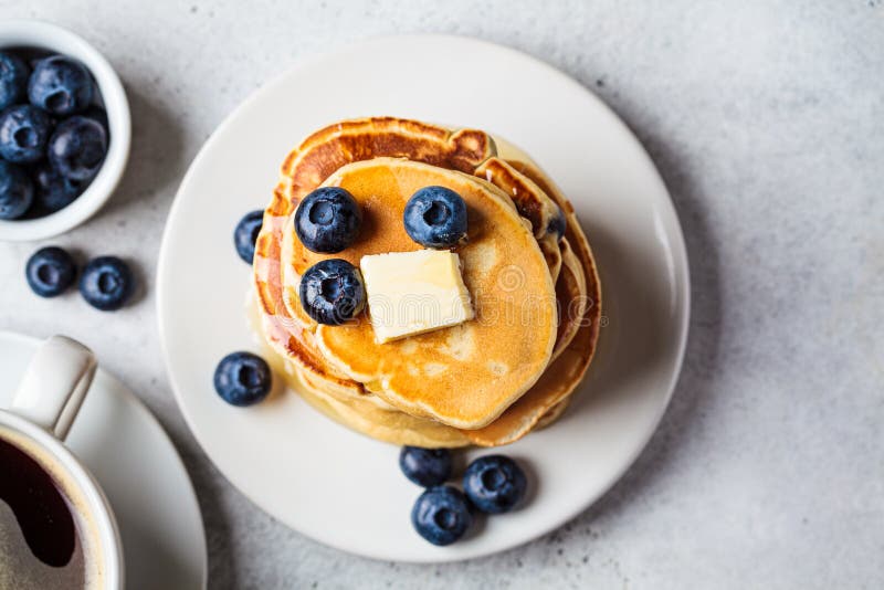 Stack of Blueberry Pancakes with Maple Syrup and Butter on White ...