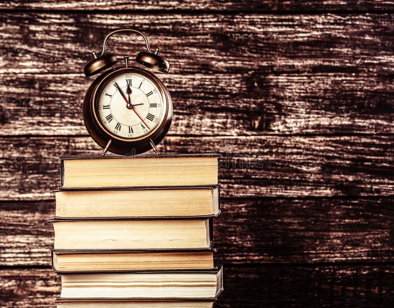 Stack of Books and Alarm Clock on it Stock Image - Image of copy, late ...