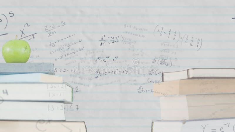 Stack of Books and Apple Against Mathematical Equations on Black Board ...