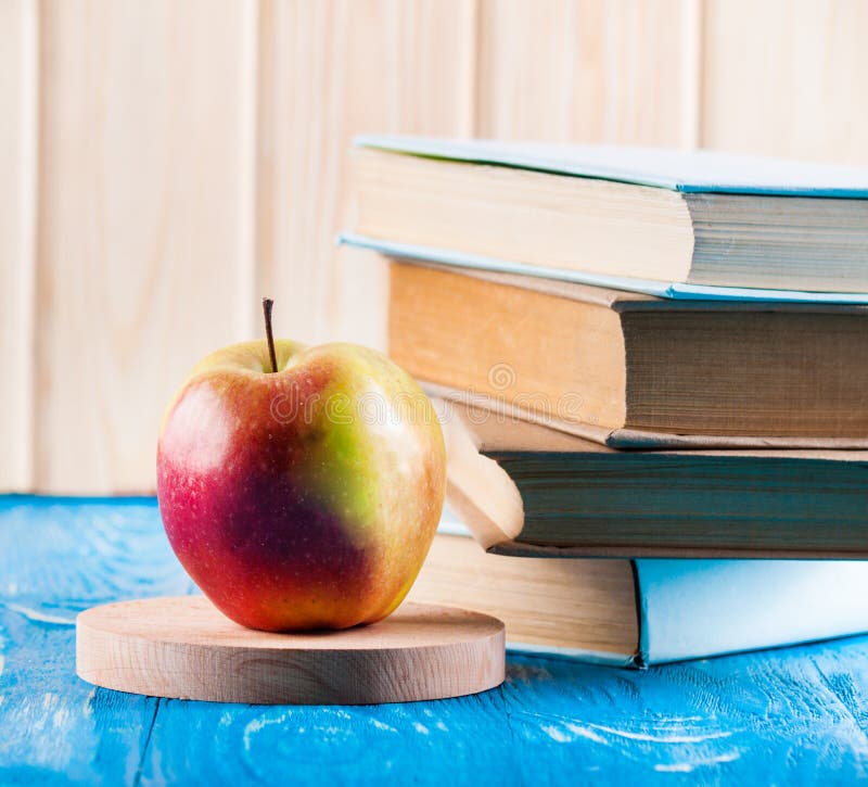 Stack of books and apple stock photo. Image of learn - 76718394