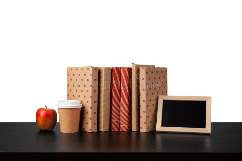 Stack of Books and Apple on Tabletop Against White Background Stock ...