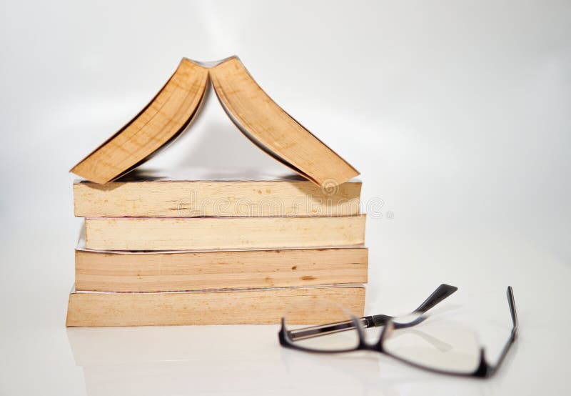 Stack of Books Arranged Pile on White Background with Glasses on Top ...