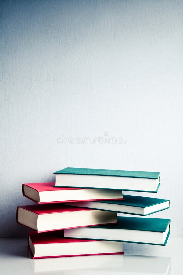 Stack of books on a table stock image. Image of book - 31259377