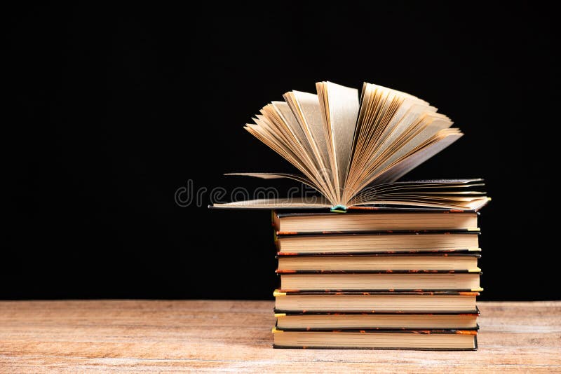 Stack of Old Books on a Black Background. Wisdom and Knowledge, Love of ...