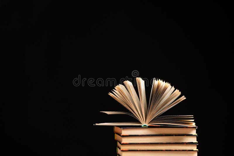 Stack of Books on Black Background, Open Book, Space for Text. Stock ...