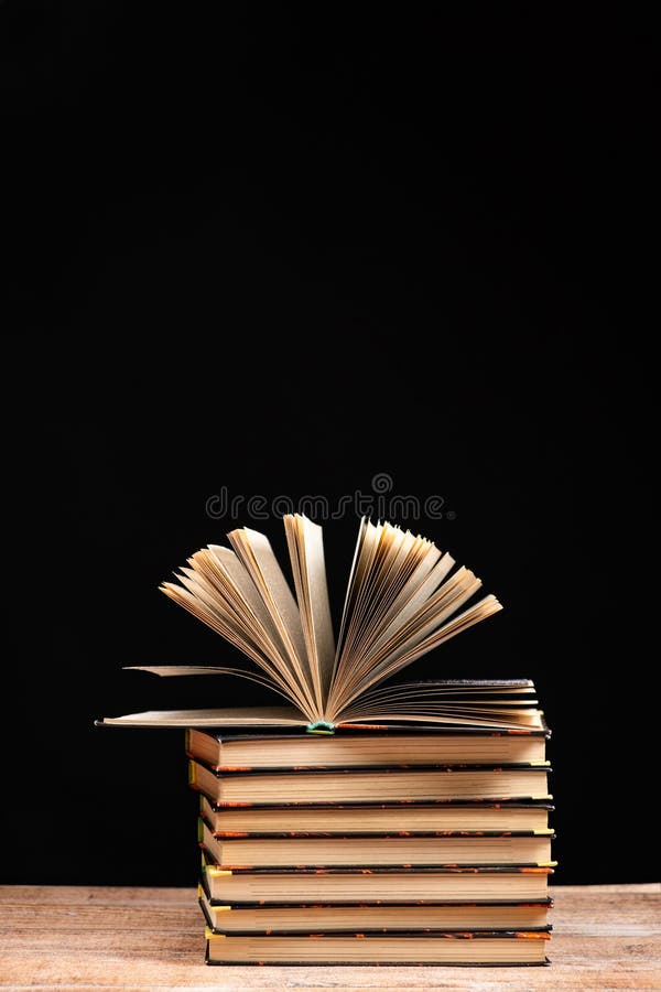 Stack of Books on Black Background, Open Book, Space for Text. Stock ...