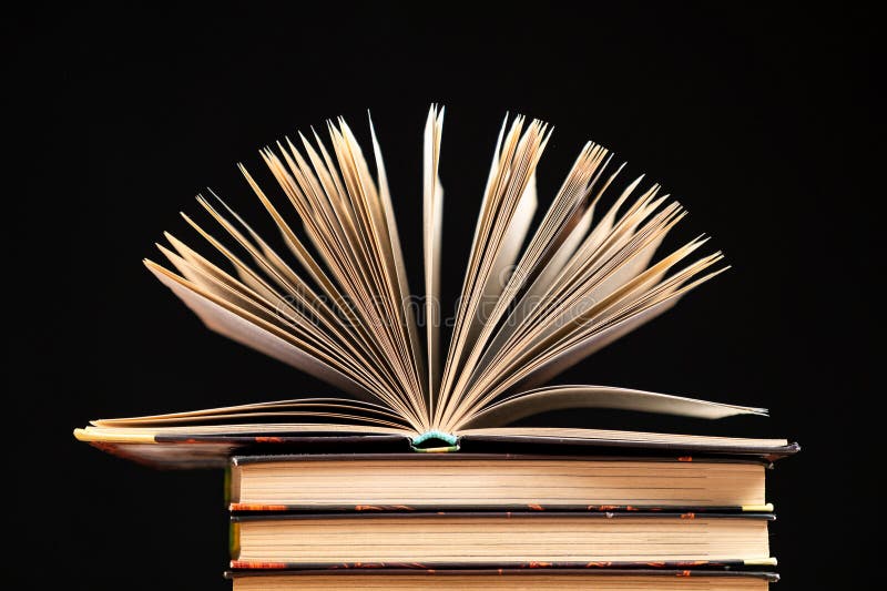 Stack of Books on Black Background, Open Book. Stock Image - Image of ...