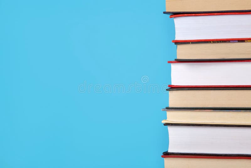 A Stack of Books on Blue Background. Stock Photo - Image of education ...