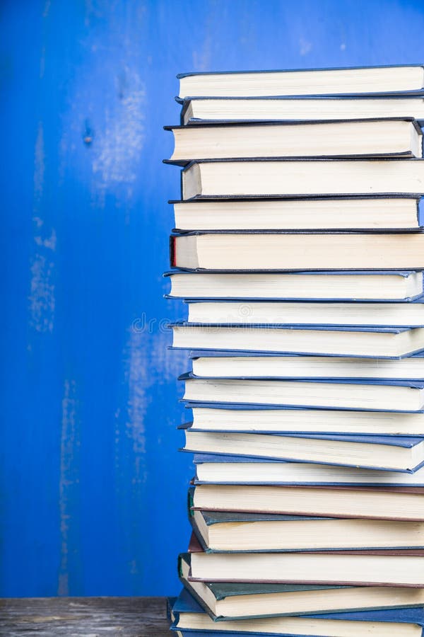 Stack Of Books On A Blue Background. Stock Photo - Image of book ...