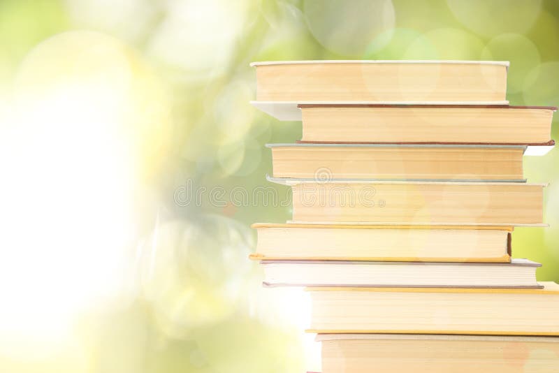 Stack of Books on Blurred Background, Space for Text. Bokeh Effect ...