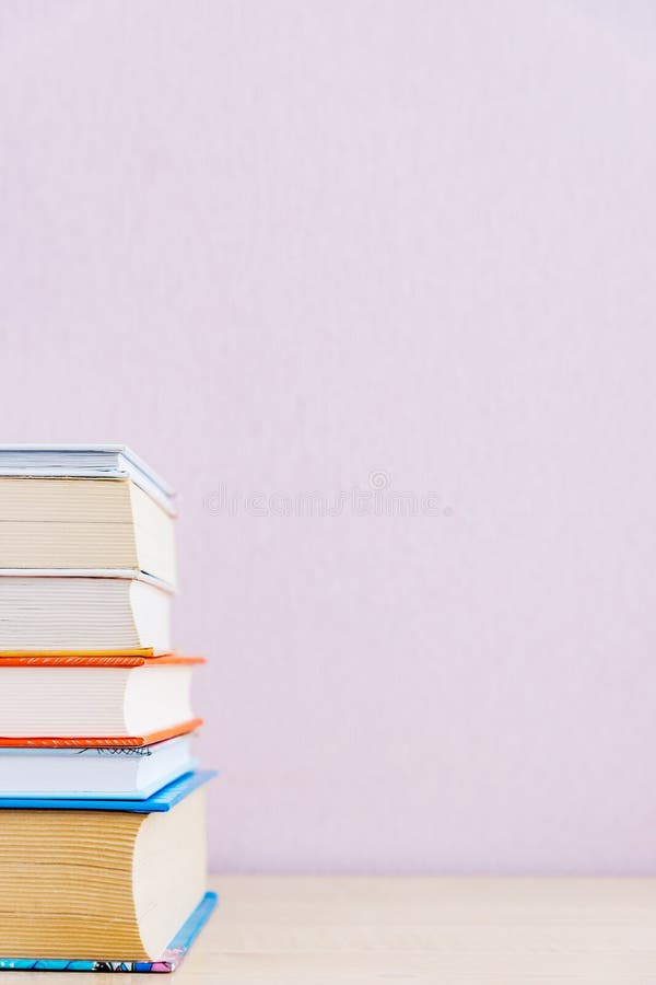 Stack of Books on Bookshelf on Simple Backdrop. Copy Space for Your ...