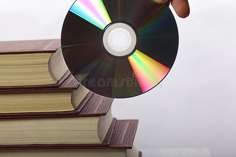 Stack of books and CD-ROM stock photo. Image of disk - 50326836