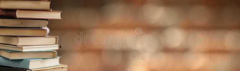 Stack of Books in the Colored Cover Lay on the Wood Table with Brick ...