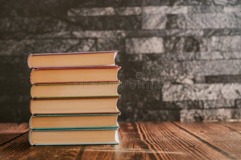 Stack of Books in the Library Room Lay on the Wood Table with Brick ...
