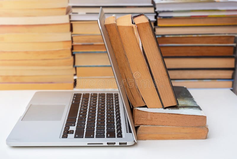 Stack of Books and a Computer on the Table Stock Image - Image of ...