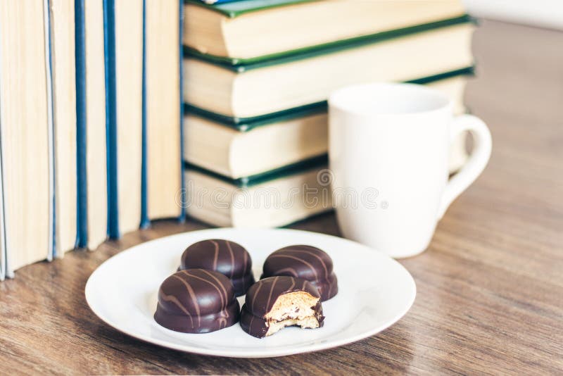 Stack of Books, Cup of Coffee and Chocolate Cookies White Plate Stock ...