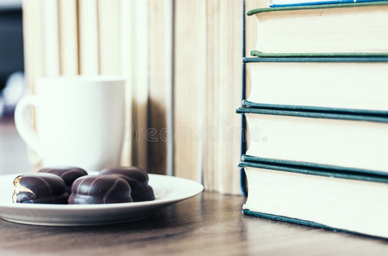 Stack of Books, Cup of Coffee and Chocolate Cookies White Plate Stock ...