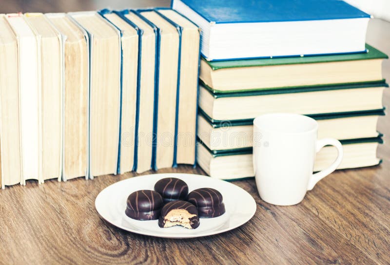 Stack of Books, Cup of Coffee and Chocolate Cookies White Plate Stock ...