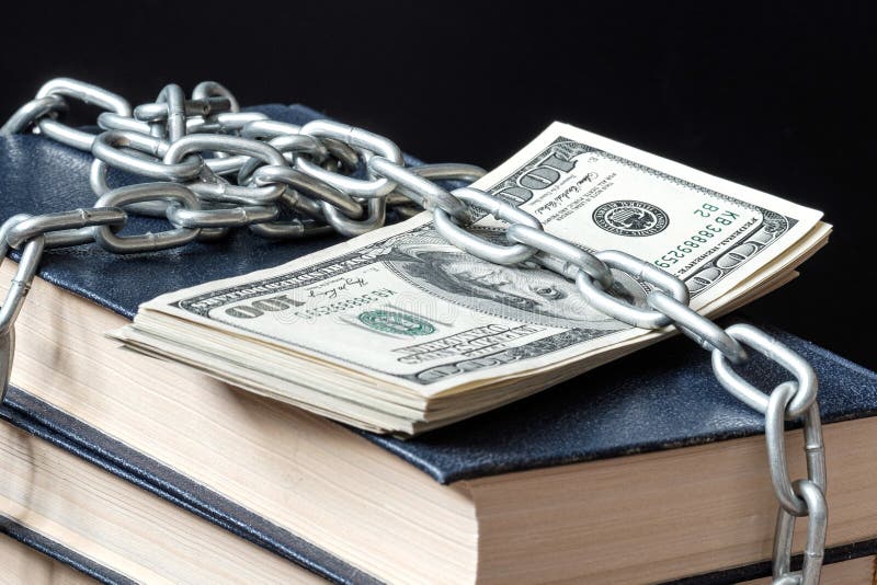 A Stack of Books on a Dark Background is Covered by a Chain Under Stock ...