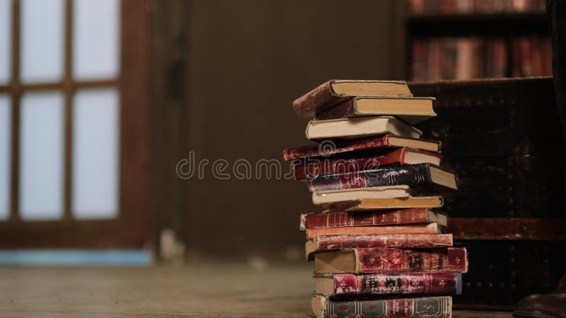 Stack of Books Falls To the Floor at Library. Education Learning ...