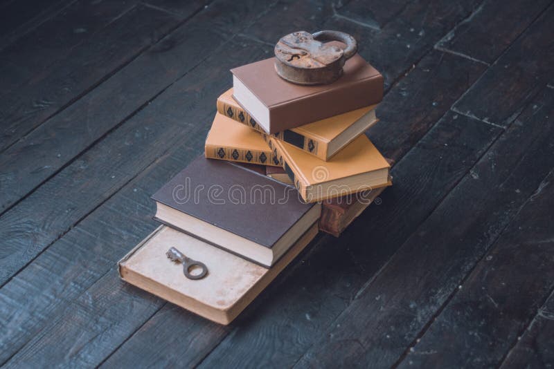 A Stack of Books on the Floor Stock Photo - Image of cover, library ...