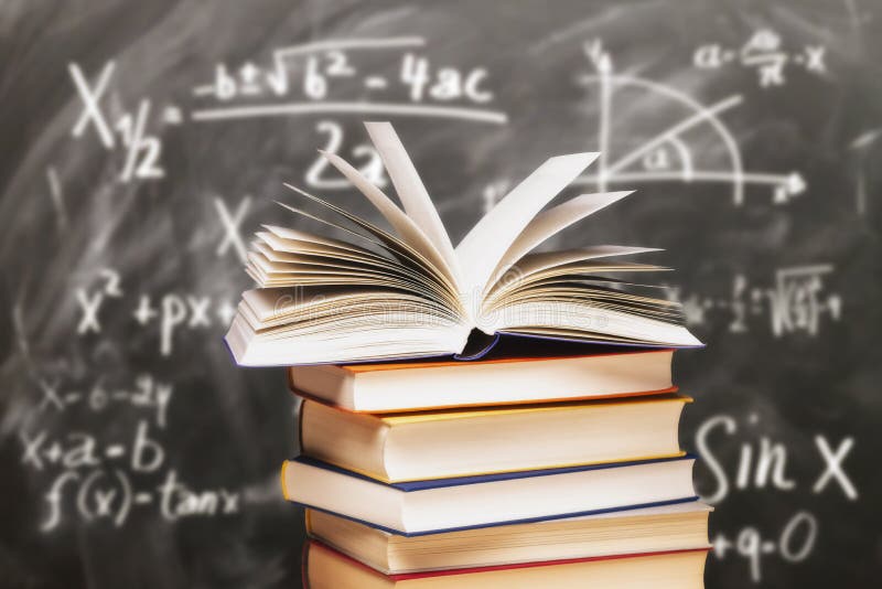 Stack of Books in Front of a Blackboard Stock Photo - Image of pile ...