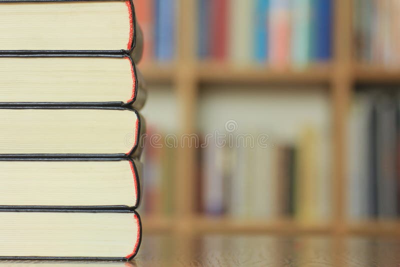 Stack of Books in Front of Bookshelf Stock Photo - Image of education ...