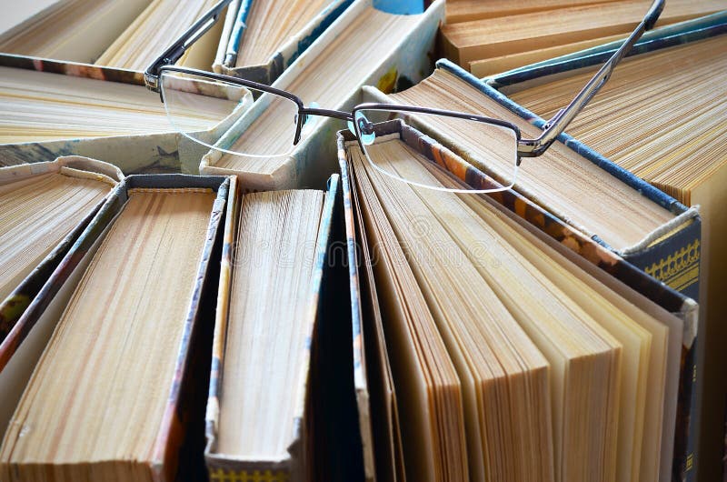Stack of Books with Glasses Stock Image - Image of paper, bunch: 49917275