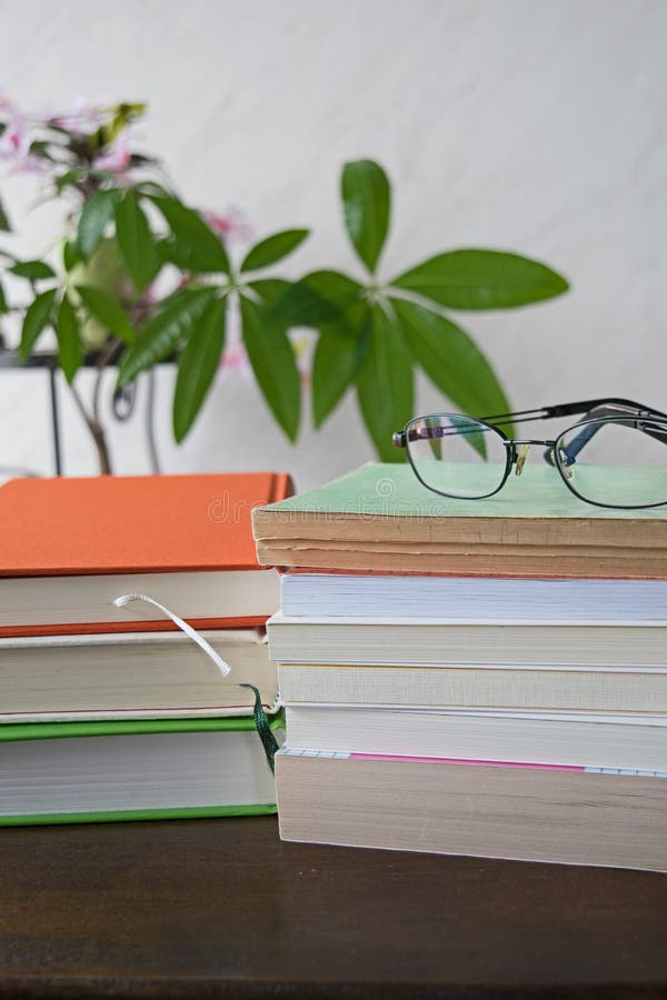 Stack of Books with Glasses on Wooden Desk Stock Image - Image of ...