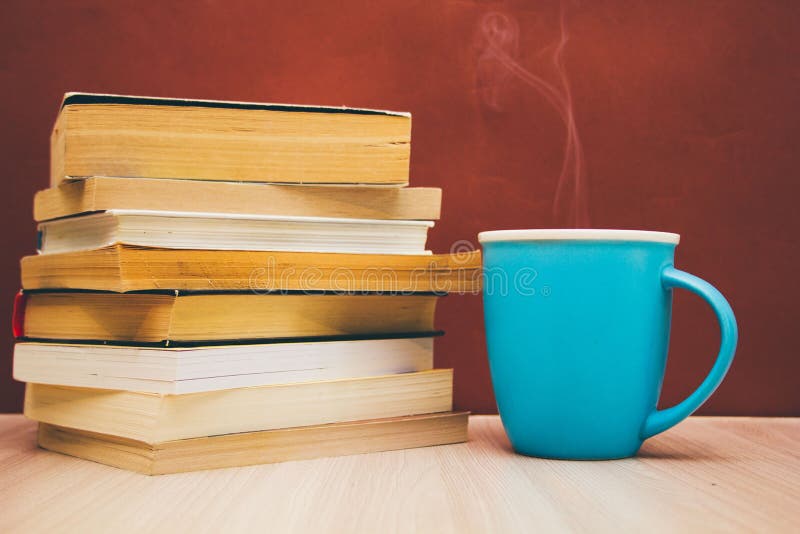 A Stack of Books and a Hot Drink in a Blue Mug Stock Image - Image of ...