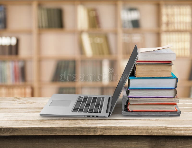 Stack of Books with Laptop on Table Stock Photo - Image of computer ...