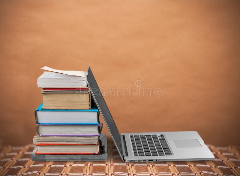 Stack of Books with Laptop on Table Stock Photo - Image of equipment ...