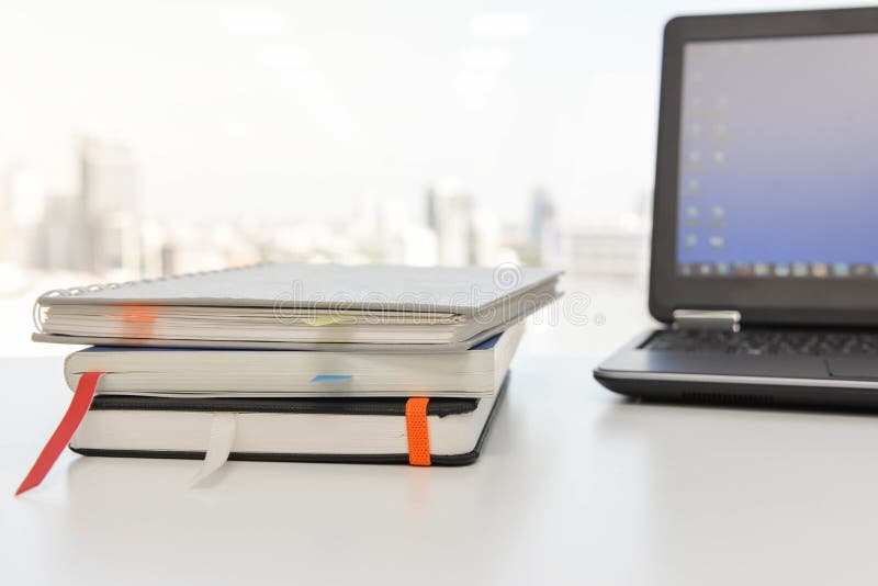 Stack of books and Laptop stock image. Image of data - 72983689