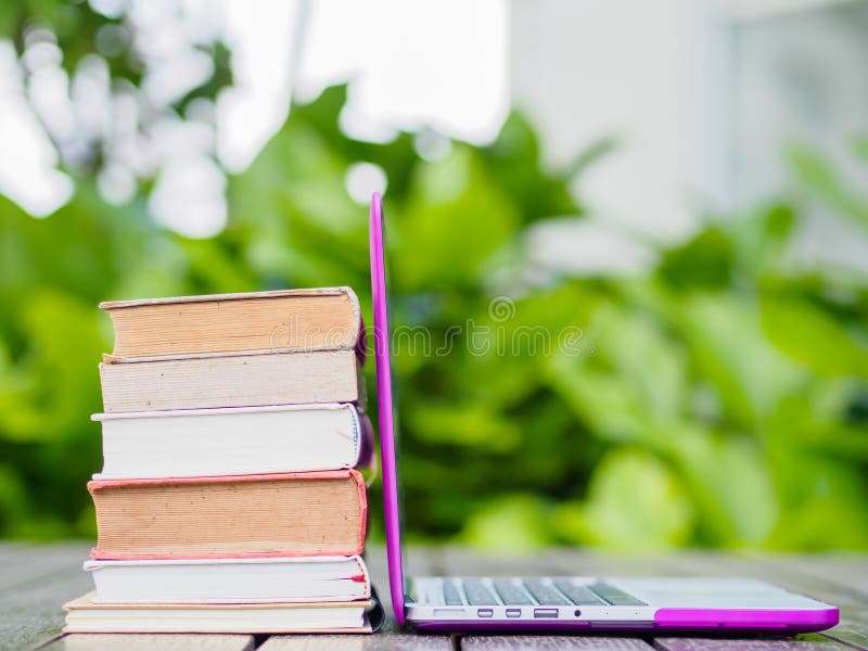 Stack of books with laptop stock image. Image of books - 90022701